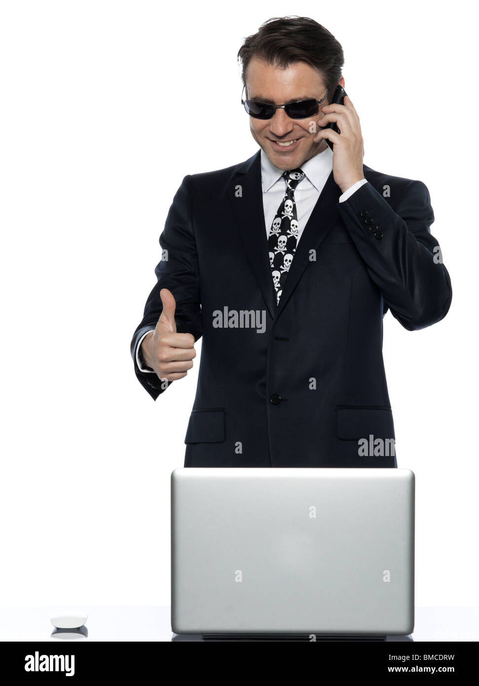 one criminal man computer hacker caucasian computing on the phone happy ...