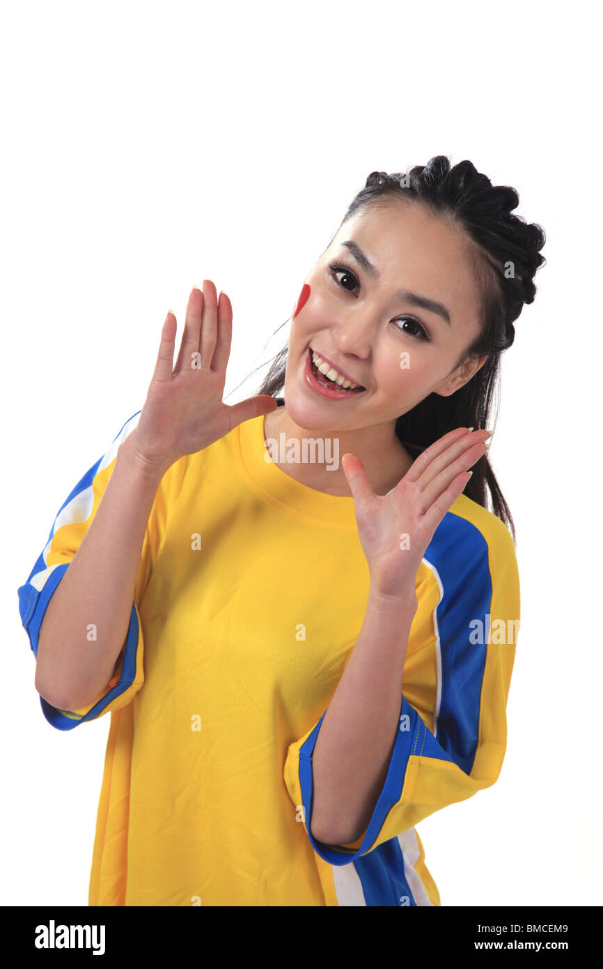 Girl fans looking at camera shouting Stock Photo - Alamy