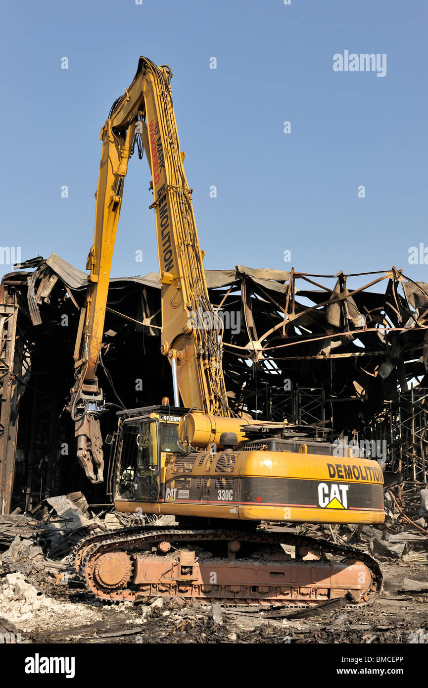 CAT Demolition digger removing steel girders Stock Photo - Alamy