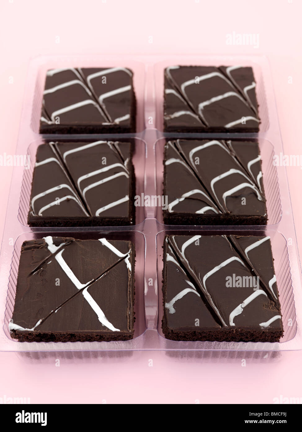 Chocolate mud cake slices isolated against a pink background Stock ...