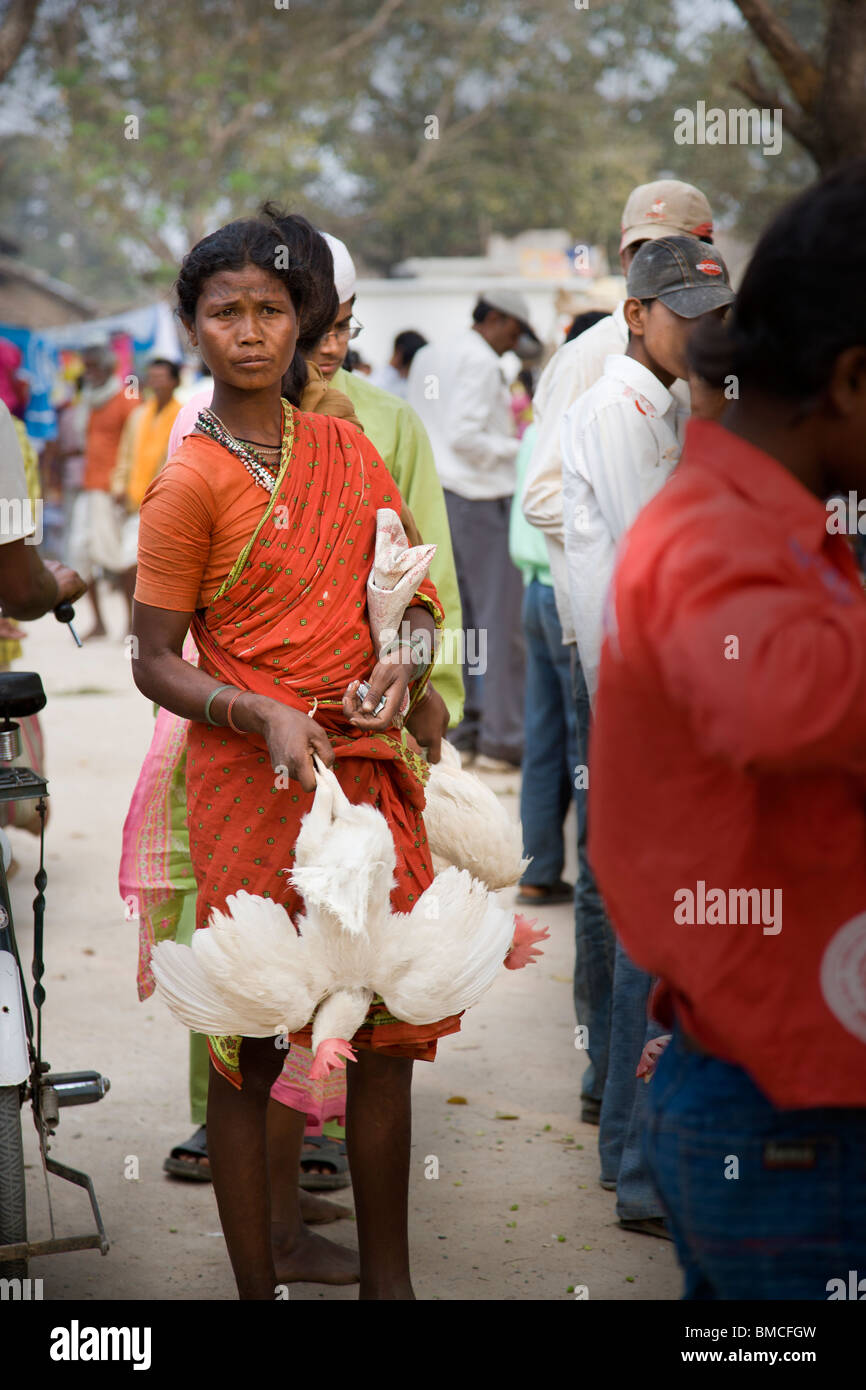 Closeup ethnic rural woman India in saree looking ahead holding ...