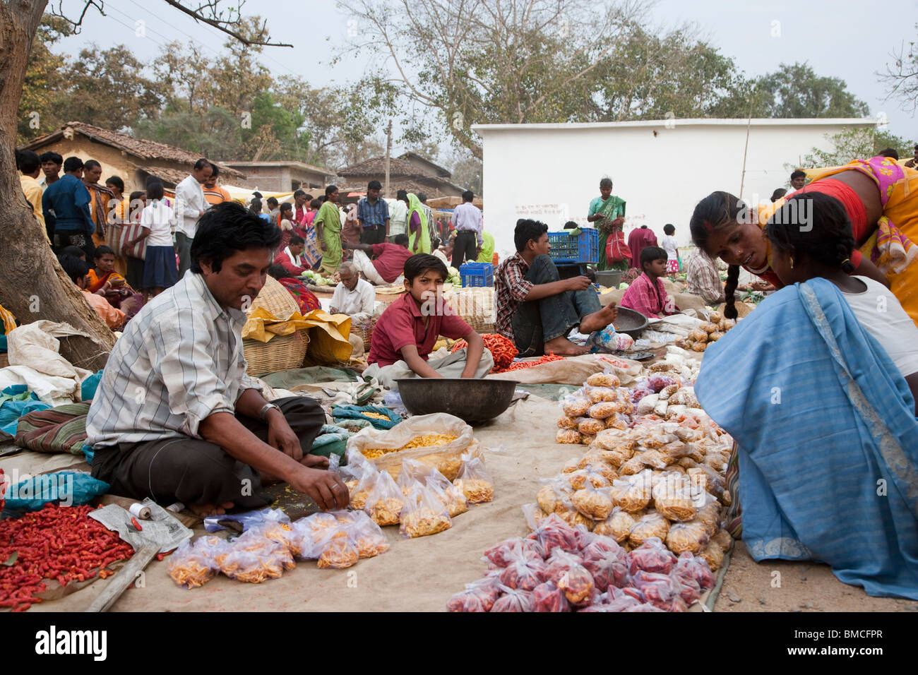 Ethnic lifestyle people selling chilies at busy rural village market ...