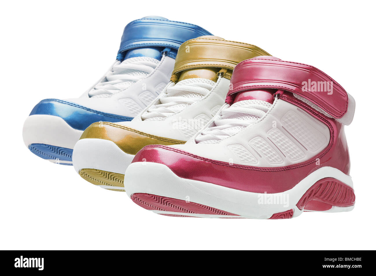 Row of colorful basketball trainers on white background Stock Photo - Alamy