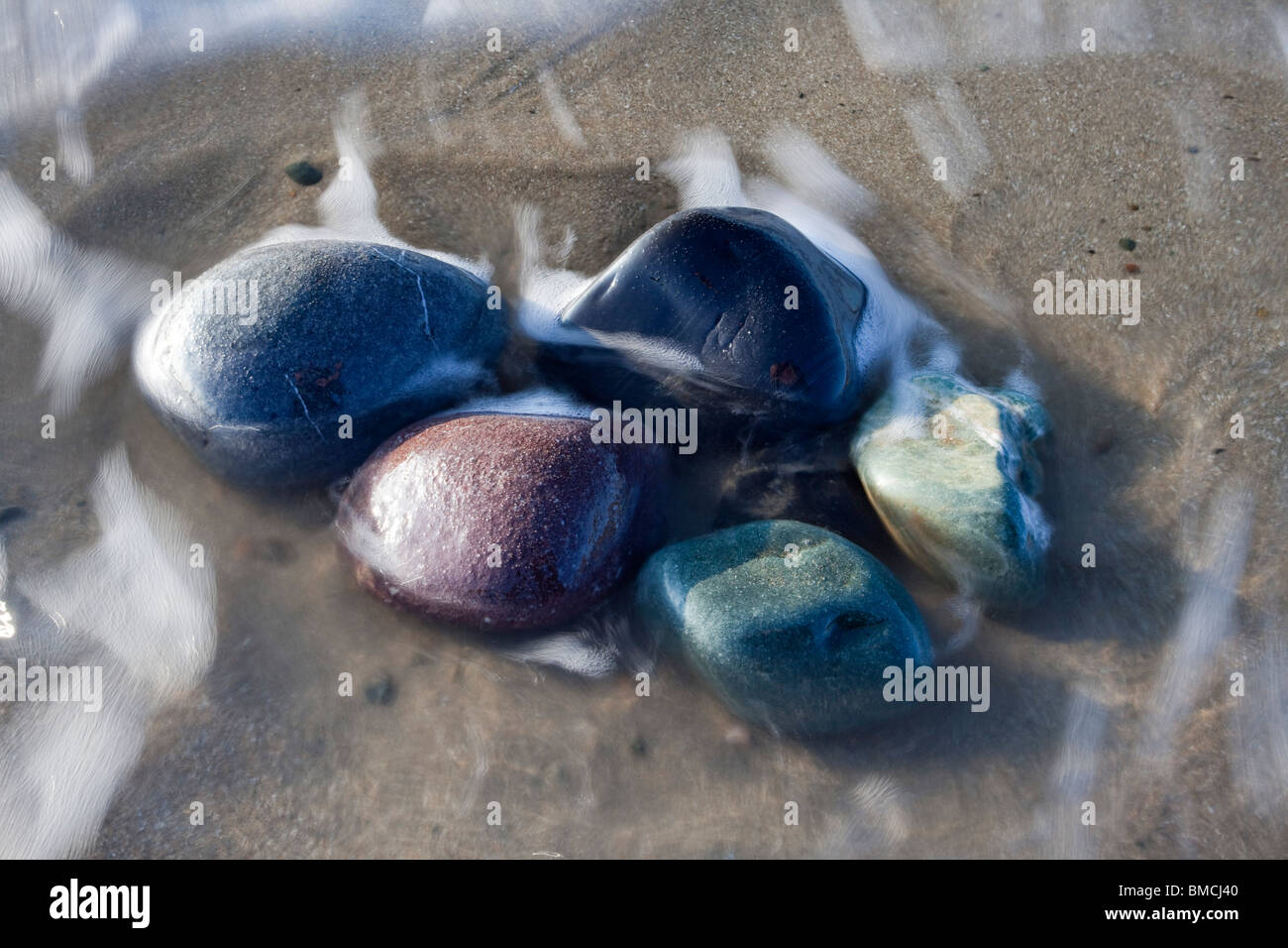 multicolored pebbles washed by the sea Stock Photo - Alamy