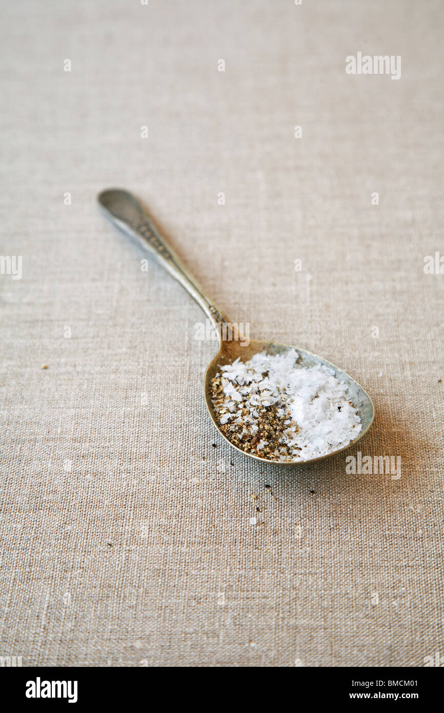 Sea Salt Flakes & Cracked Black Pepper on Vintage Spoon Stock Photo - Alamy
