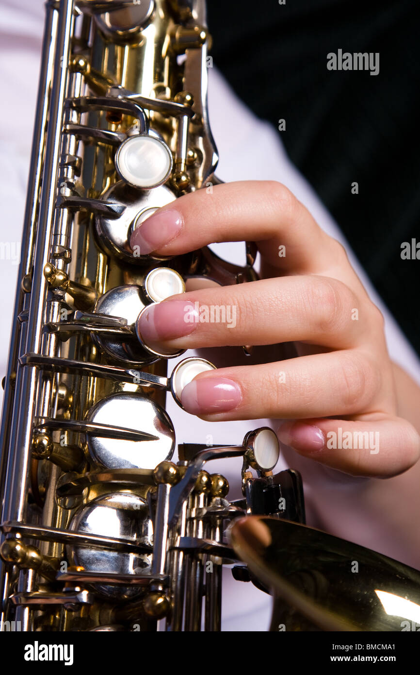 Girl playing saxophone hi-res stock photography and images - Alamy