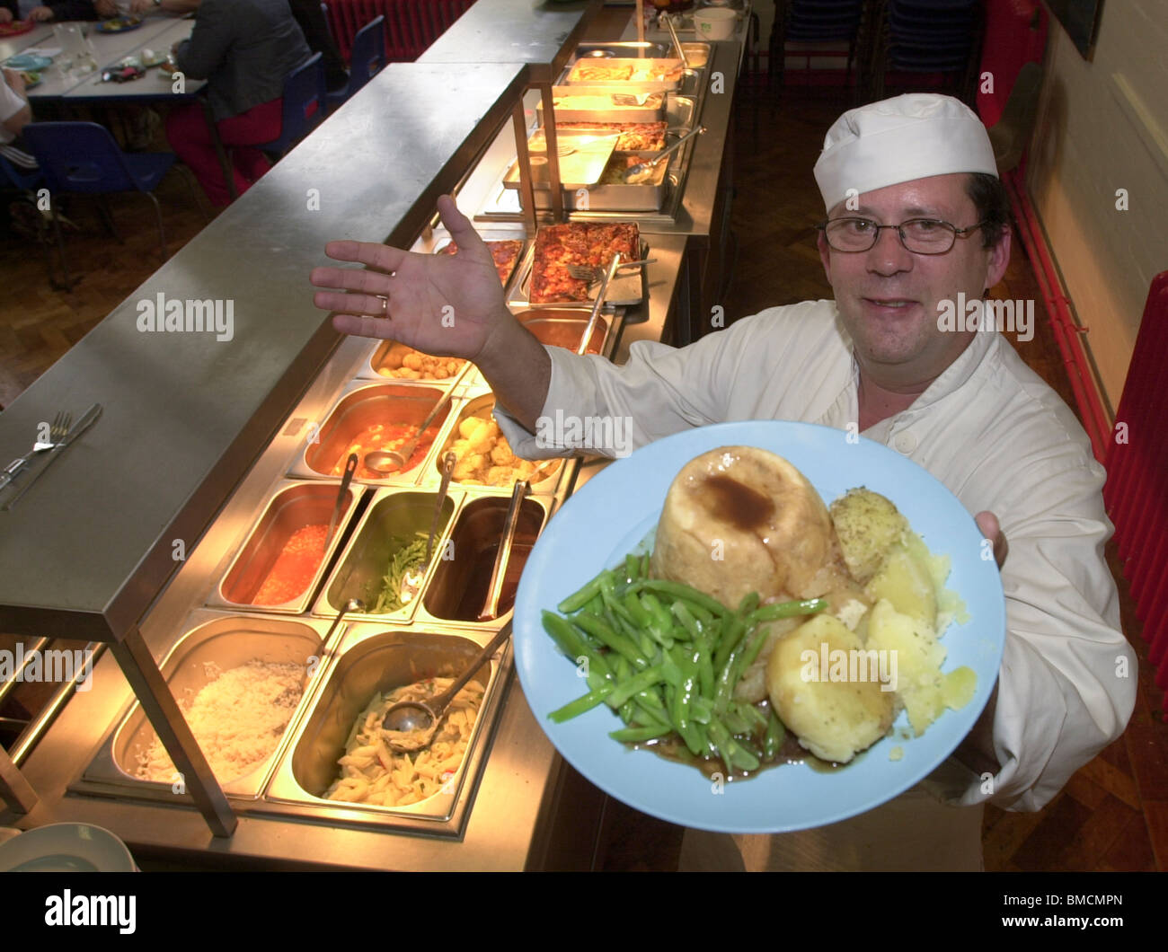 A school Dinner Man prepares the days food for the children UK Stock ...