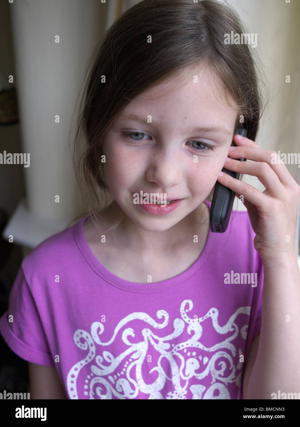 Young girl using mobile phone. England. UK Stock Photo - Alamy