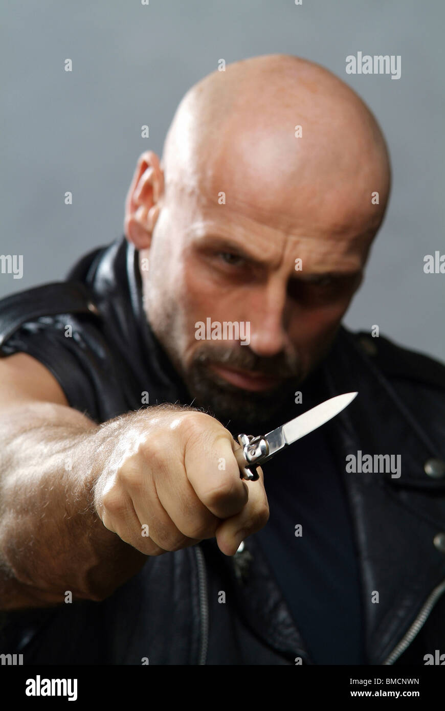 A man with a knife Stock Photo - Alamy