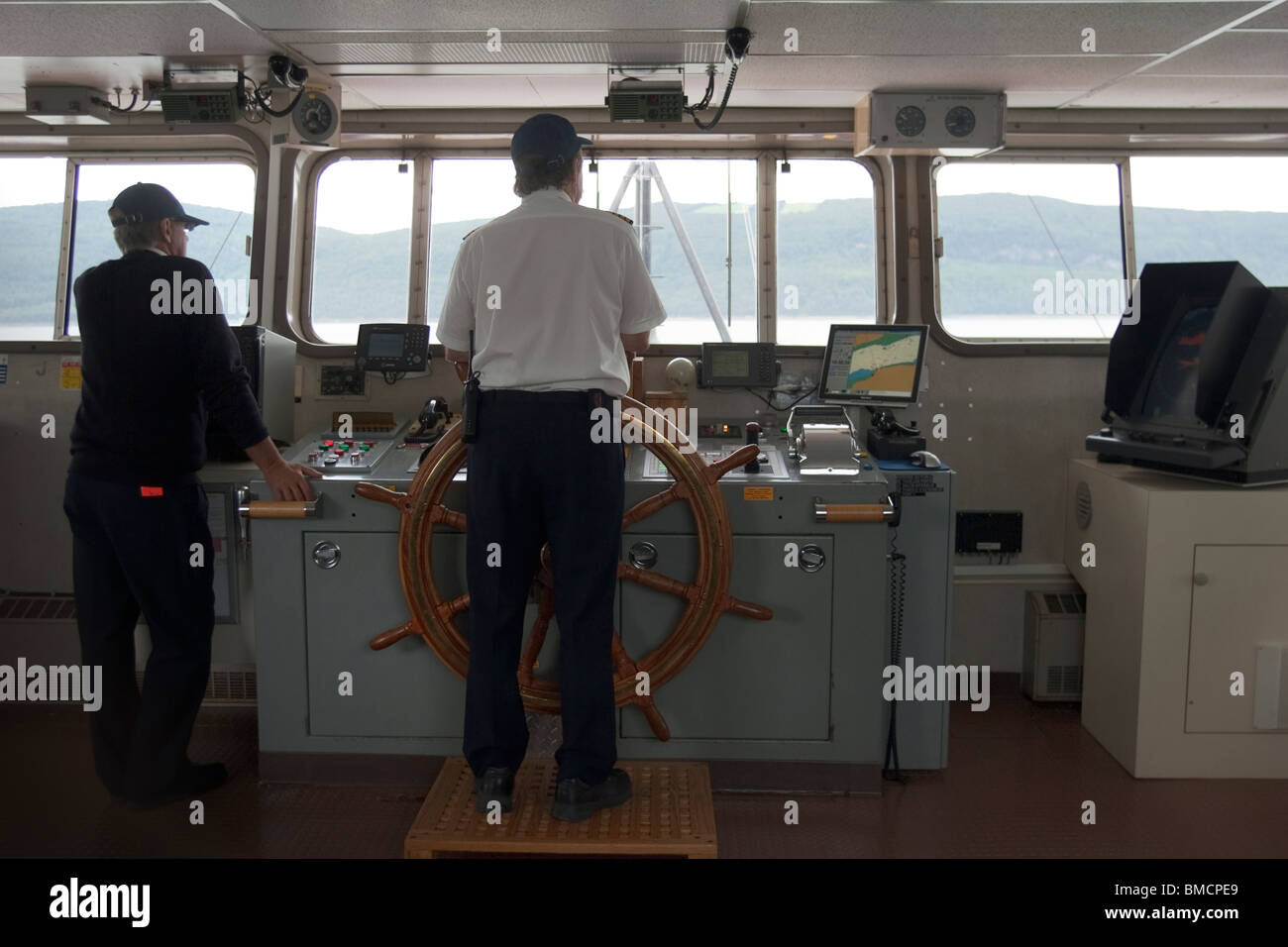 The captain and navigation officer on the bridge of the car ferry Stock ...