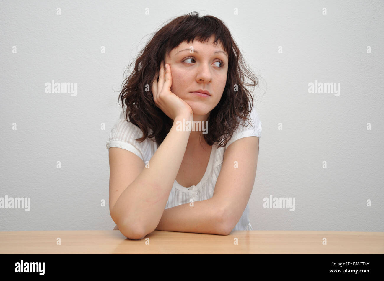 Young woman being bored Stock Photo - Alamy