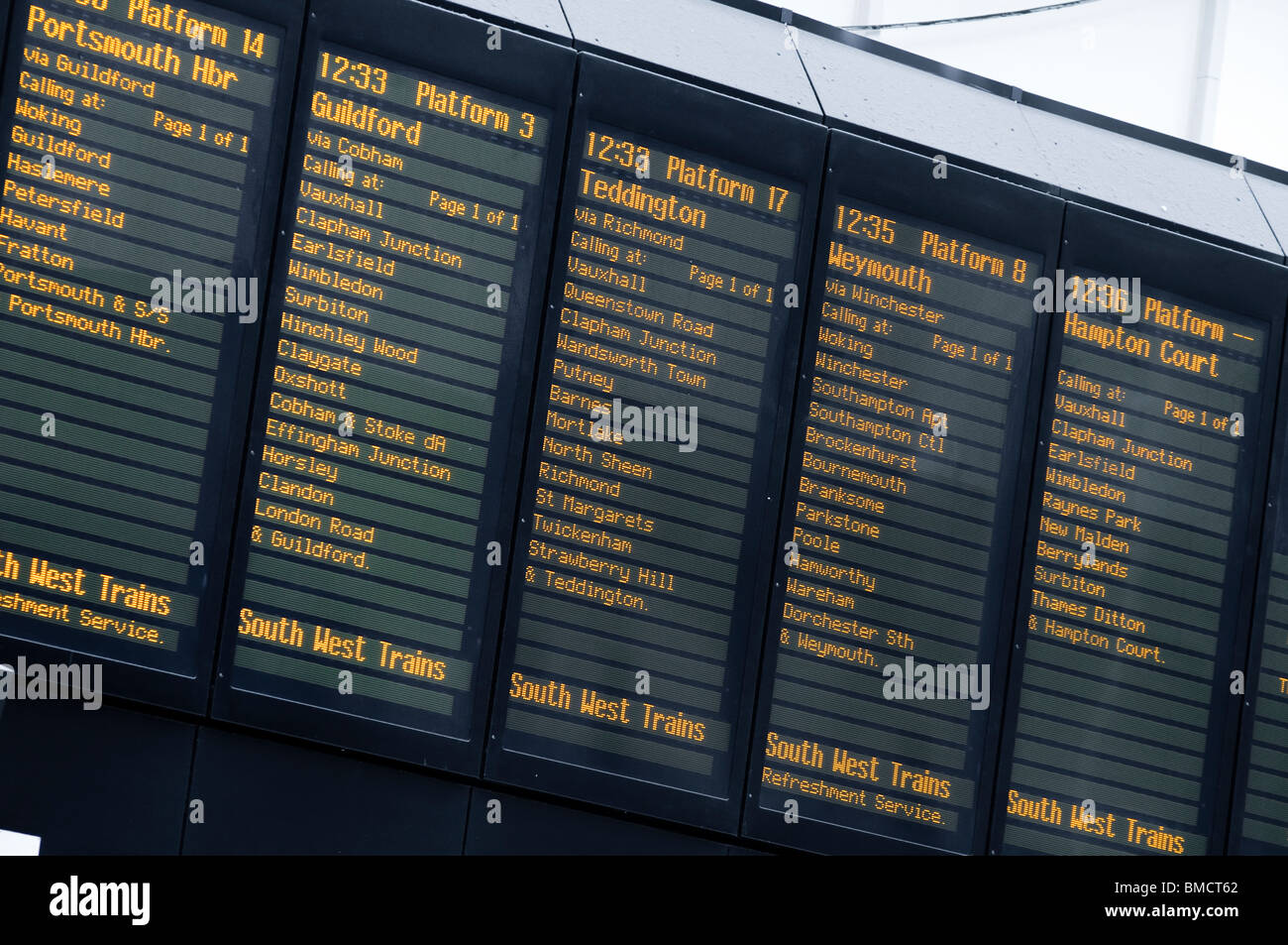 Train times and destinations board Stock Photo - Alamy
