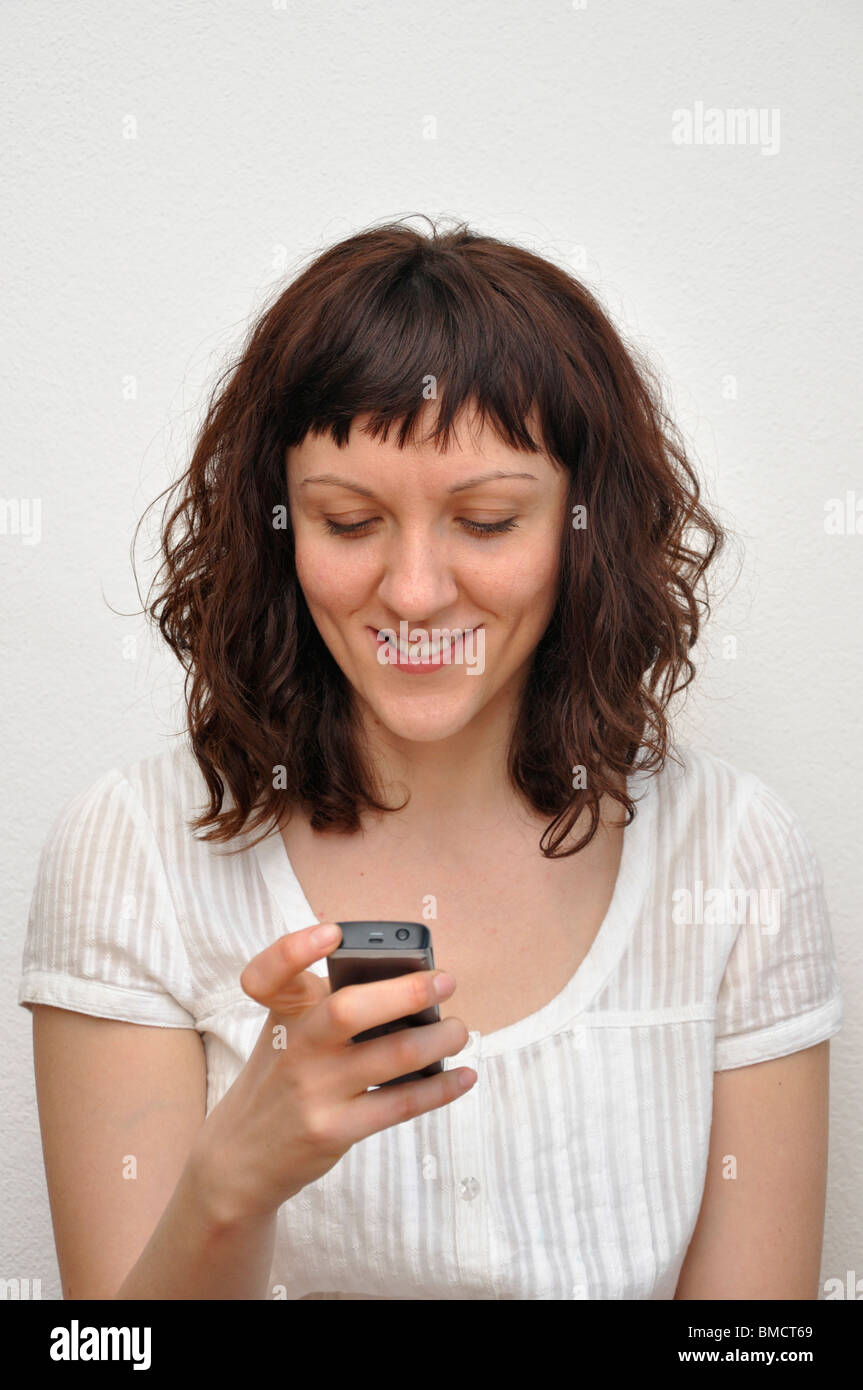 Woman reading text message Stock Photo - Alamy
