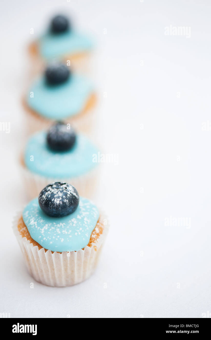 Colourful blueberry mini fruit cupcakes on a white background Stock ...