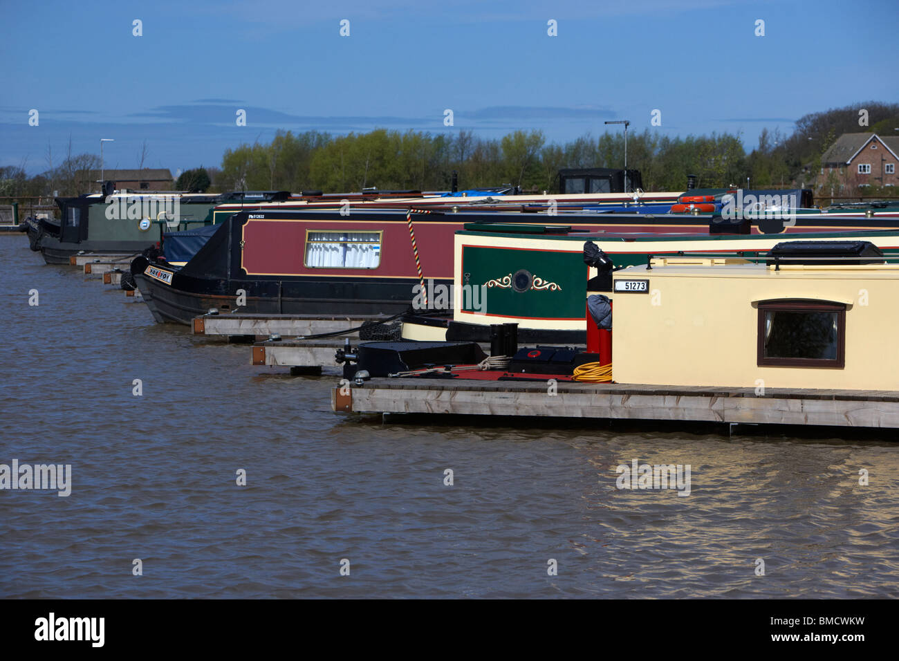 traditional english narrow and wide canal boats moored at scarisbrick ...