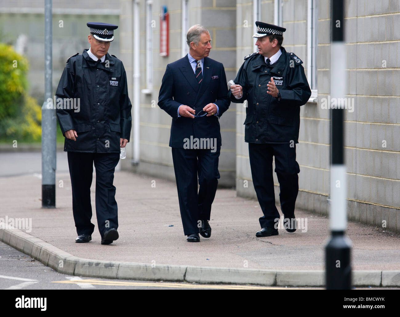 Britain's Prince Charles, the Prince of Wales, walking with two senior ...