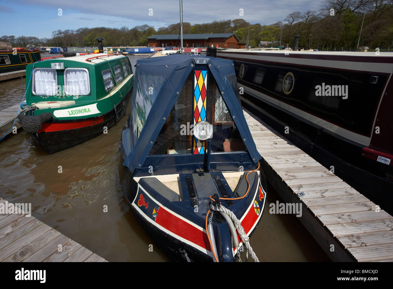 traditional english narrow and wide canal boats moored at scarisbrick ...