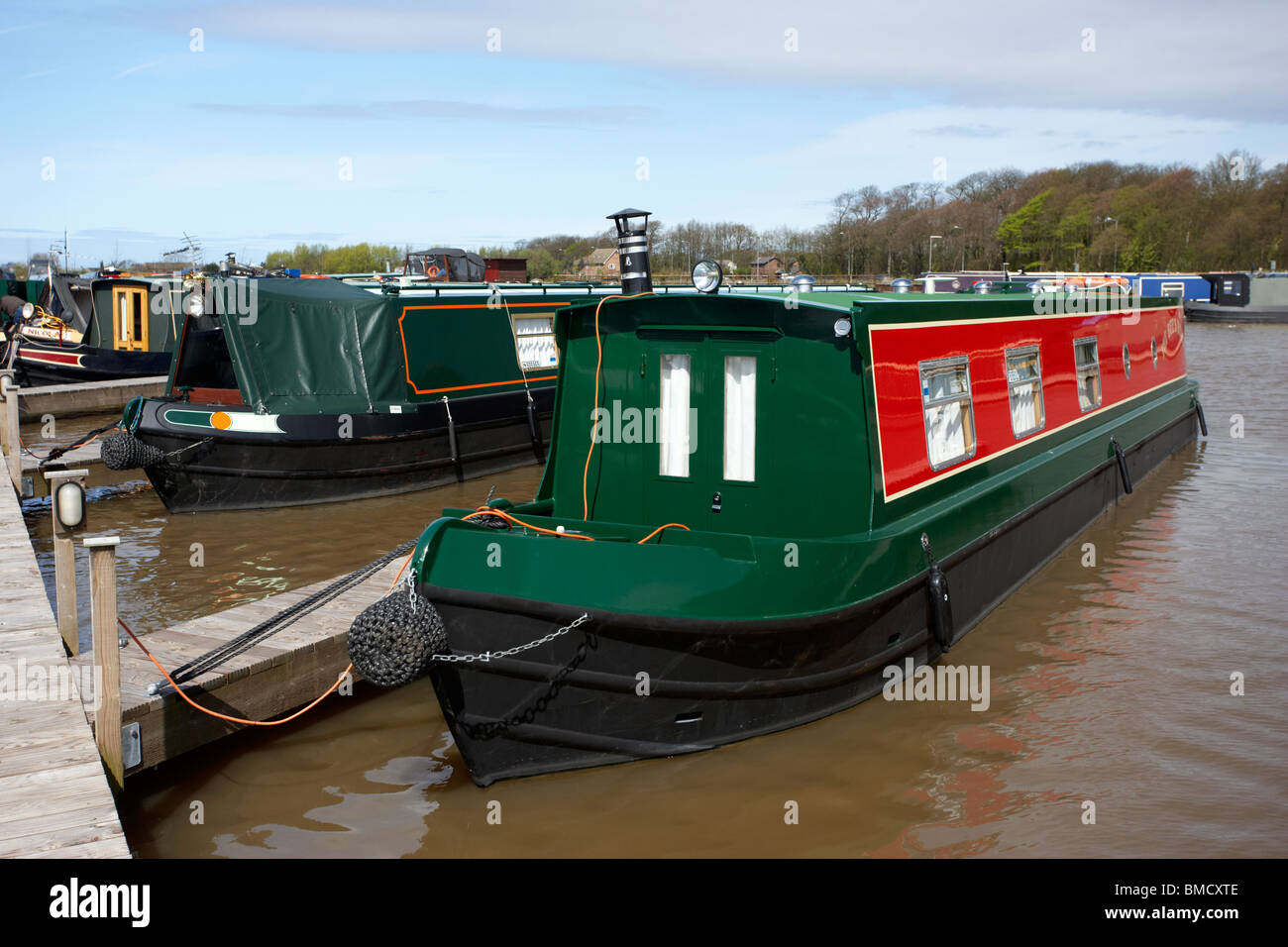traditional english narrow and wide canal boats moored at scarisbrick ...
