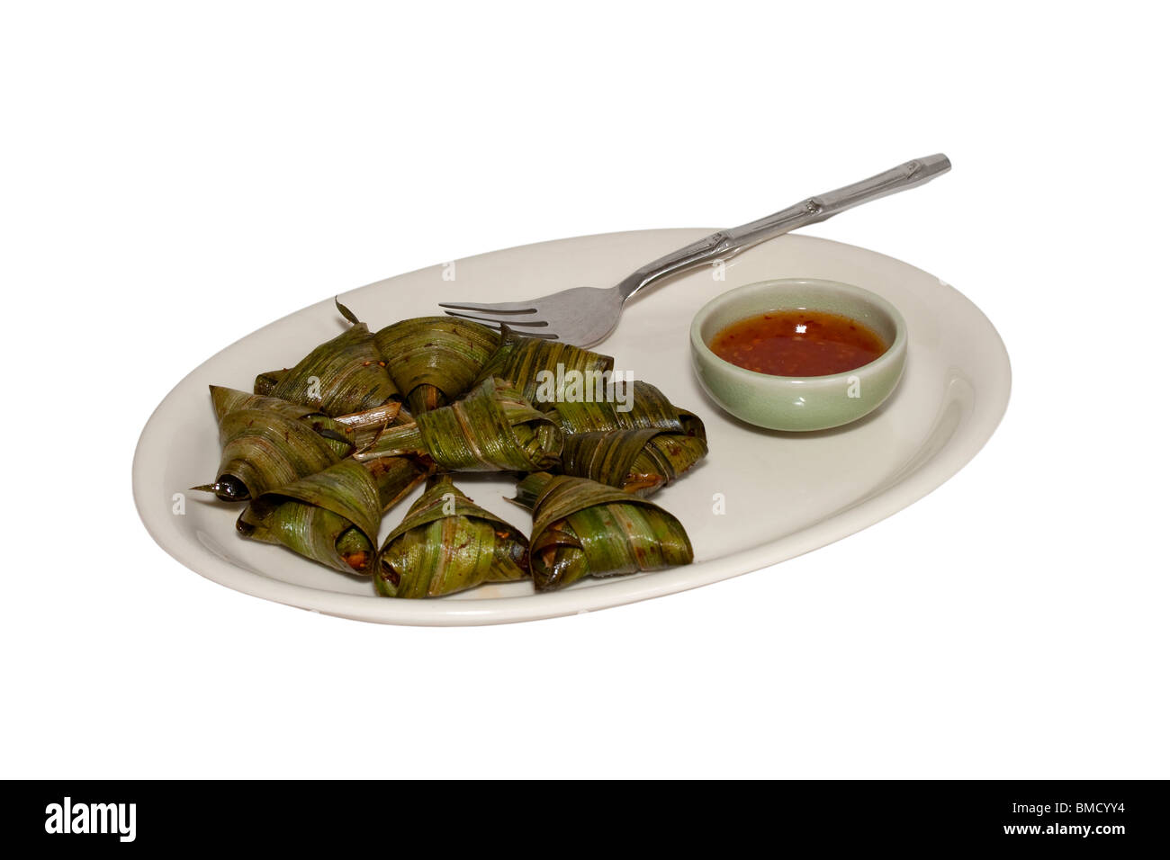 Deep fried chicken in pandon leaves (Thai food appetizer) with sauce ...