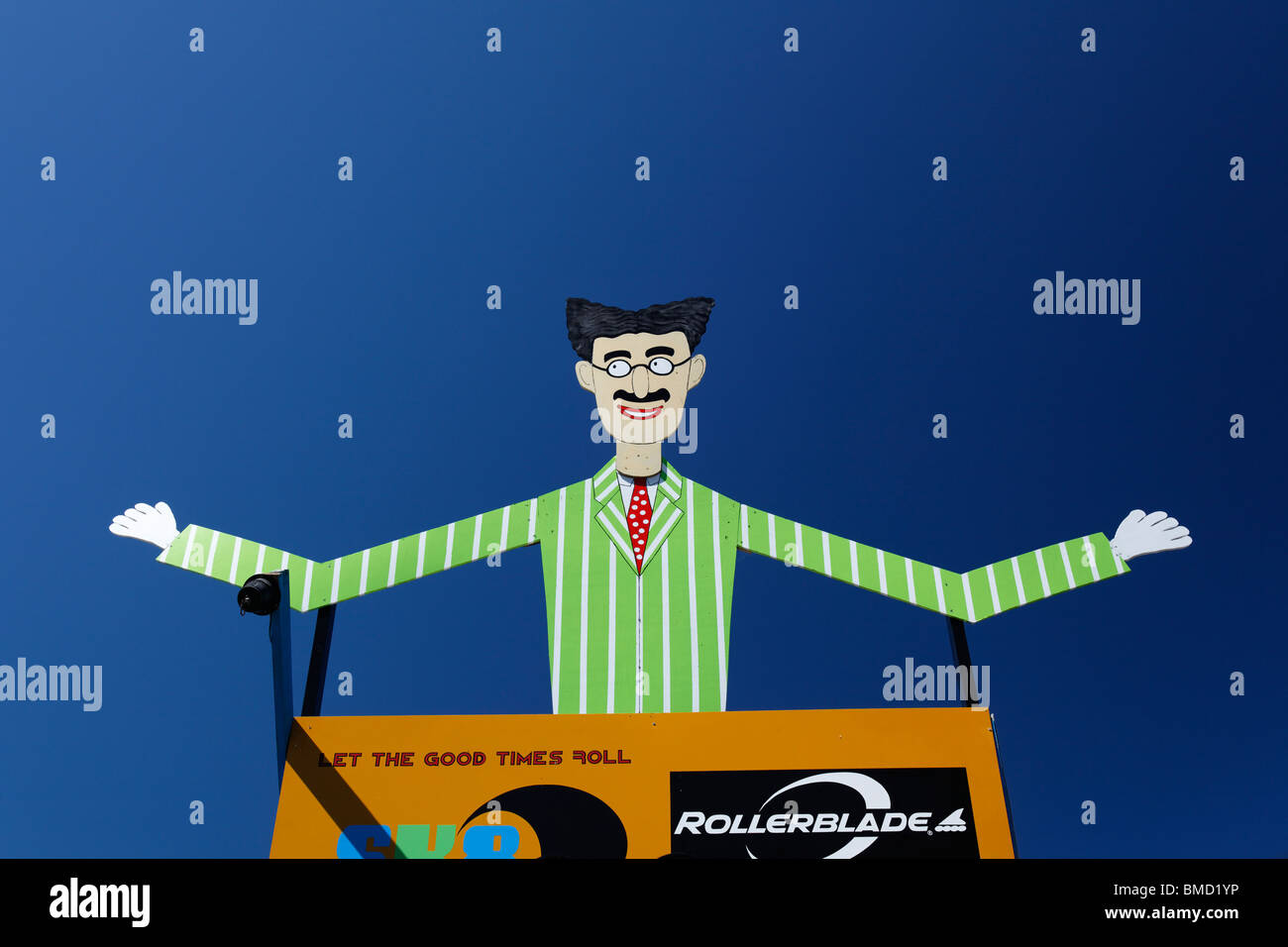 A cartoon figure with outstretched arms above a sign displaying 'LET ...