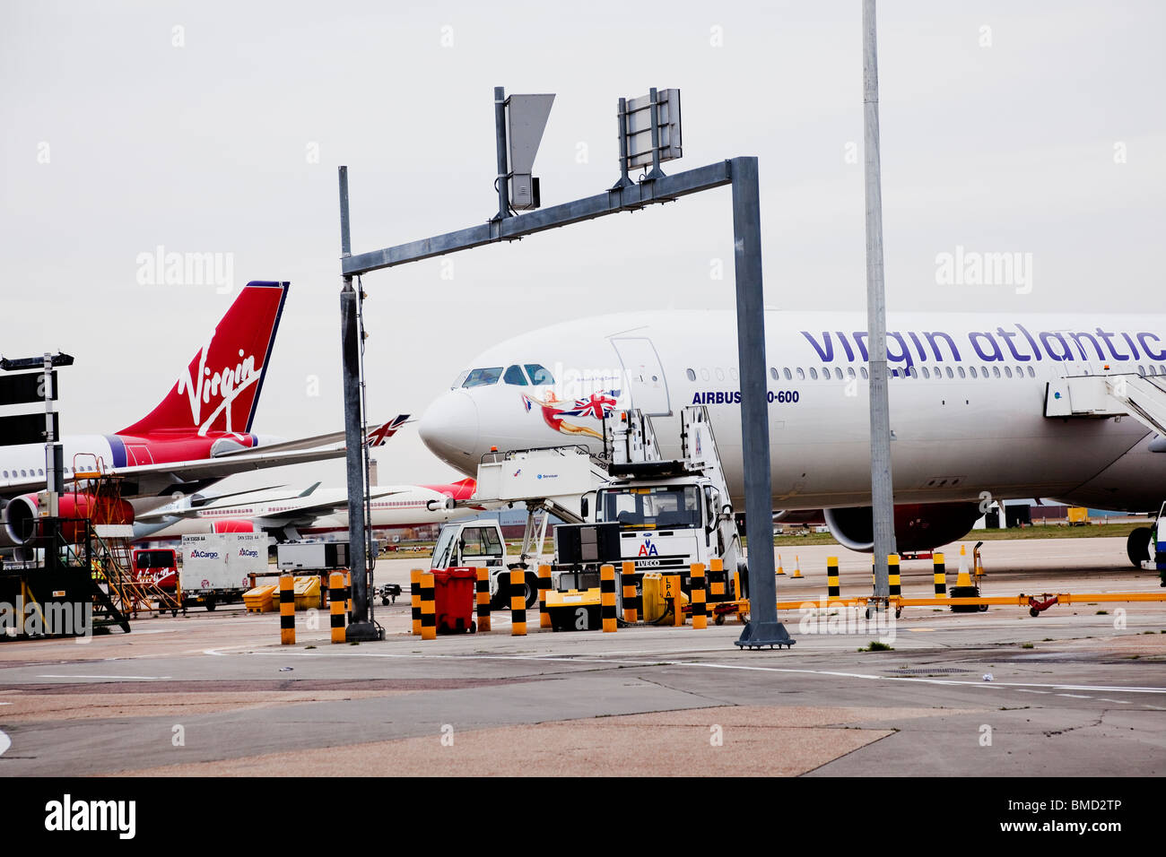 Two Virgin Atlantic Airbus' stand on the tarmac at London's Heathrow ...