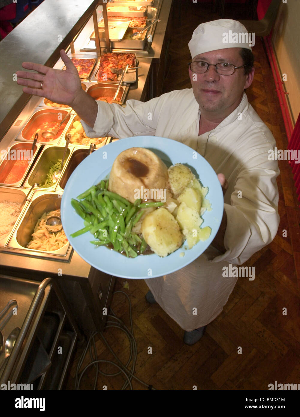 A school Dinner Man prepares the days food for the children UK Stock ...
