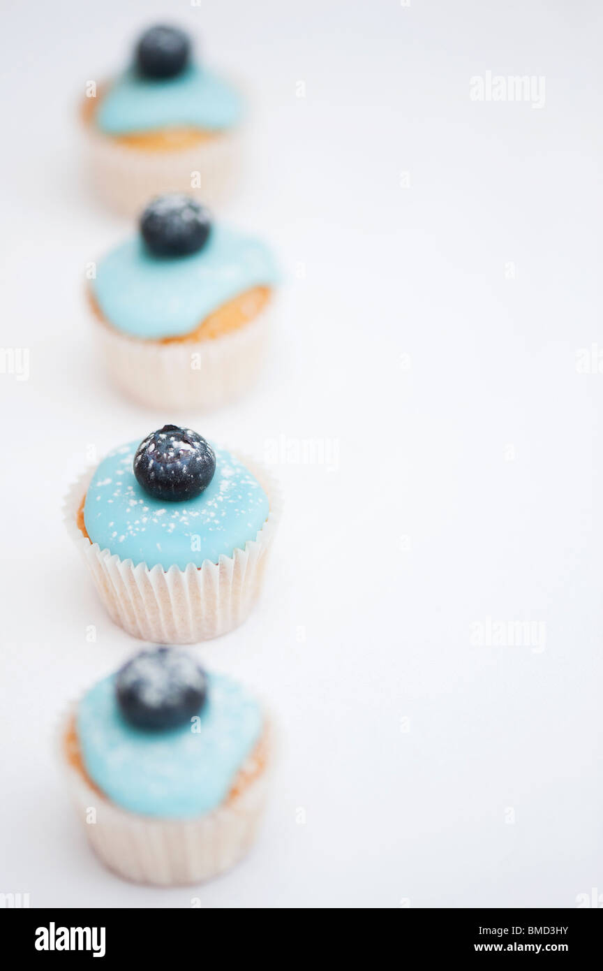 Colourful blueberry mini fruit cupcakes on a white background Stock ...