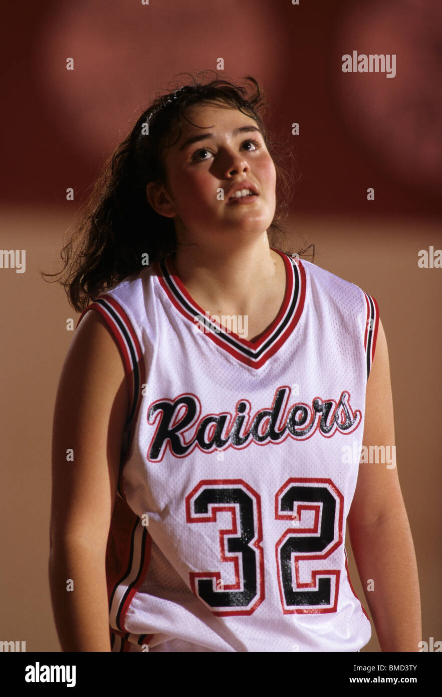 Teenage girl looking frustrated while playing in a high school ...