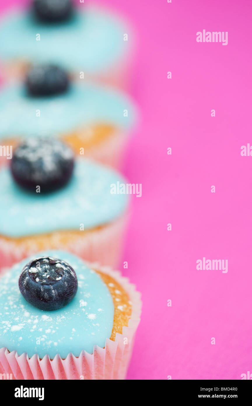 Colourful blueberry mini fruit cupcakes on a pink background Stock ...