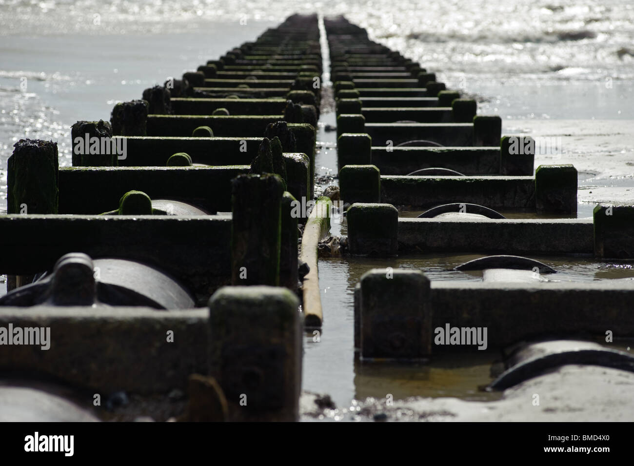 Water outfall on the beach Stock Photo - Alamy