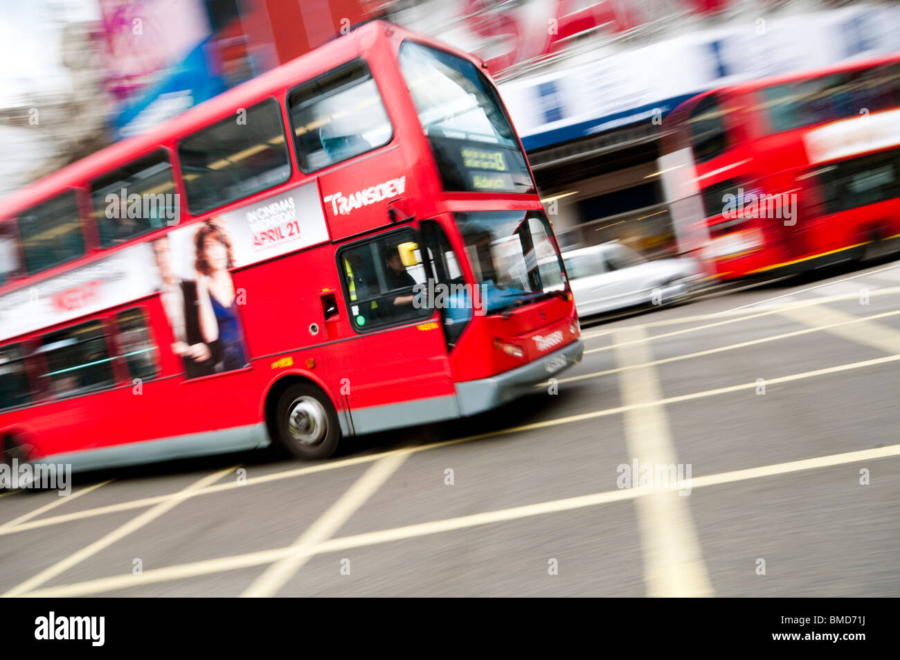 London Bus moving through Piccadilly Circus Stock Photo - Alamy