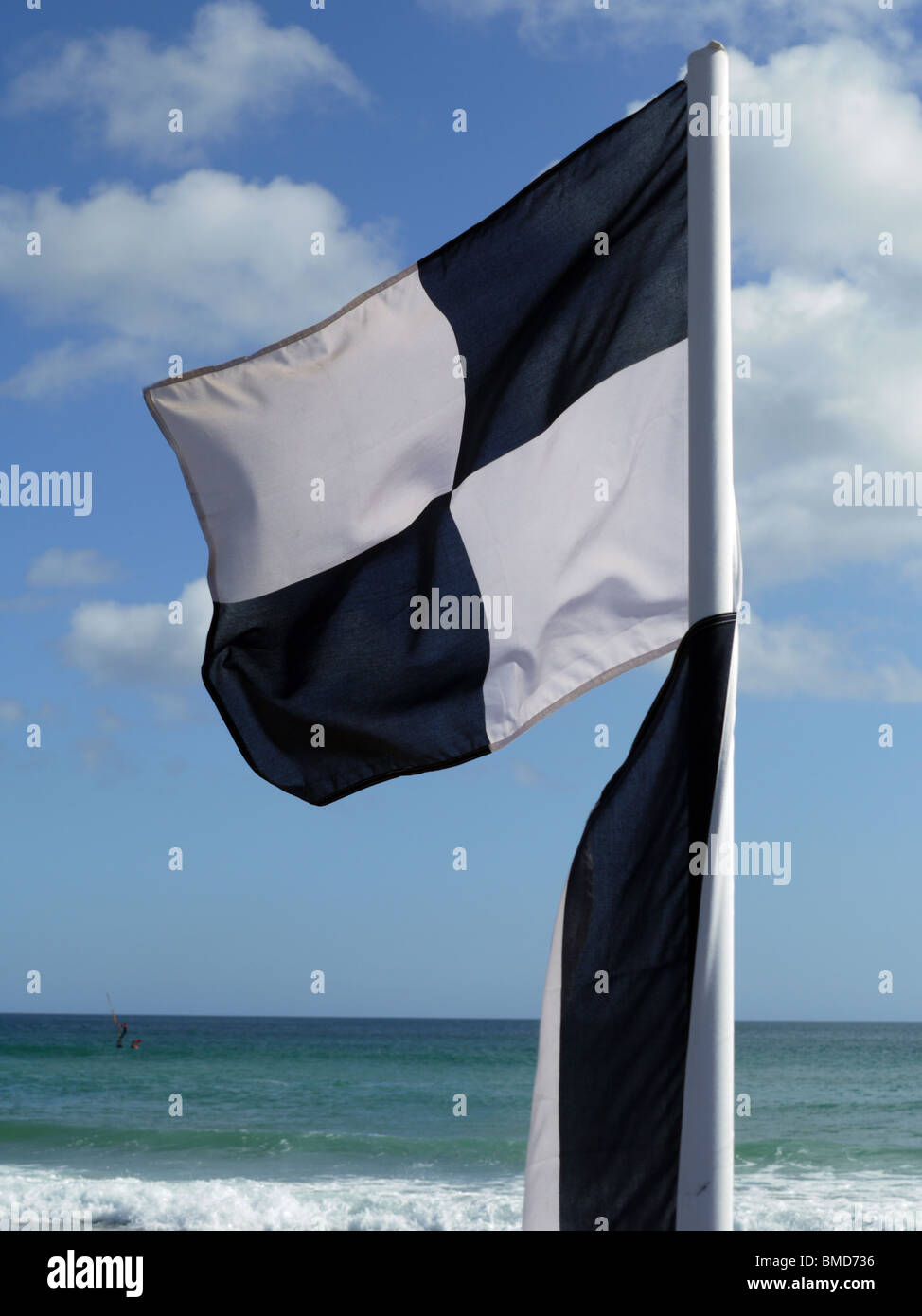 Surf safety flag flying on Praa Sands Beach Cornwall UK Stock Photo - Alamy