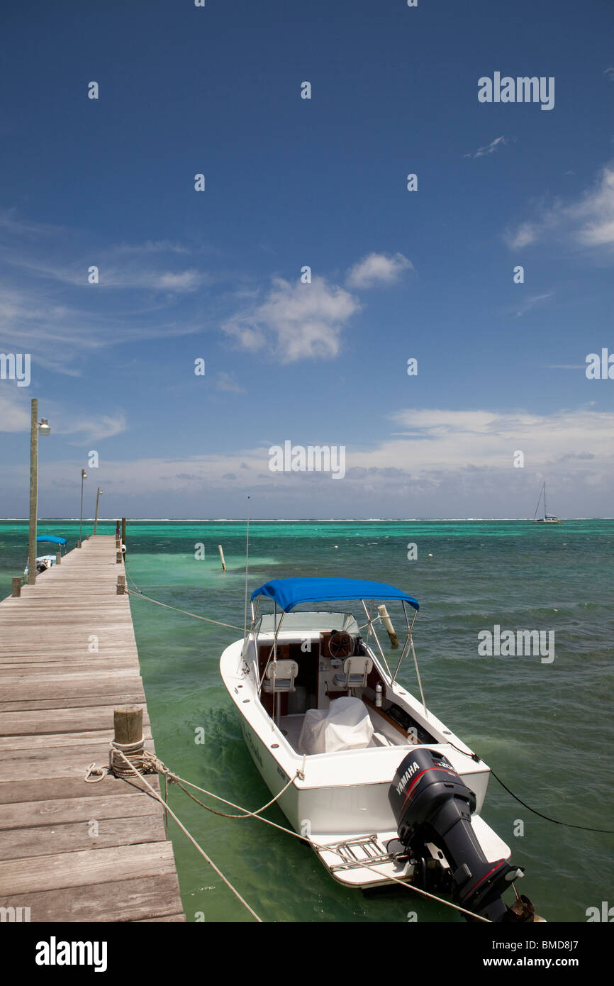 A boat tethered to a dock in Belize Stock Photo - Alamy