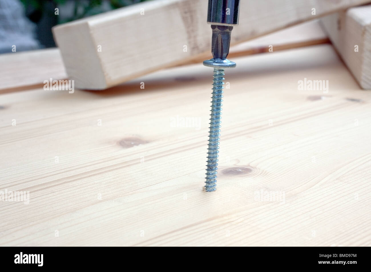 carpentry: screwdriver, screw and wood planks. vertical shot Stock ...