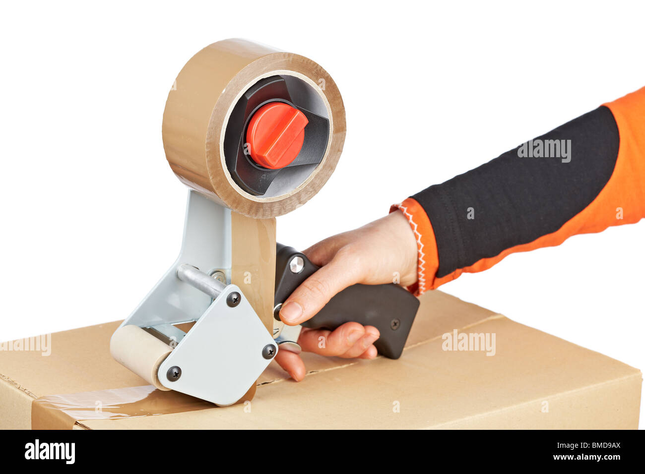 Packaging tape dispenser and shipping box isolated on white background ...