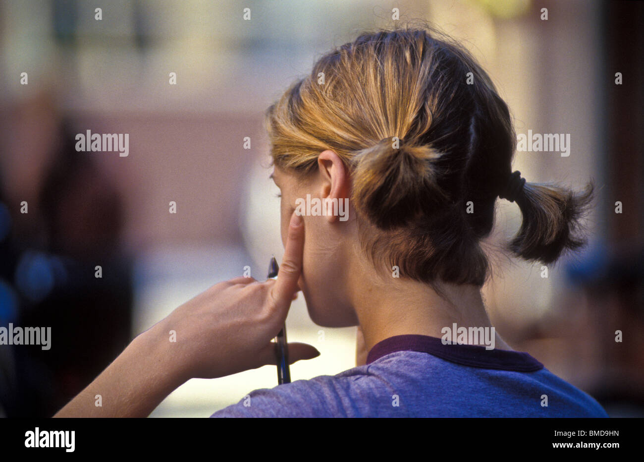 One female student reading, contemplating Stock Photo - Alamy