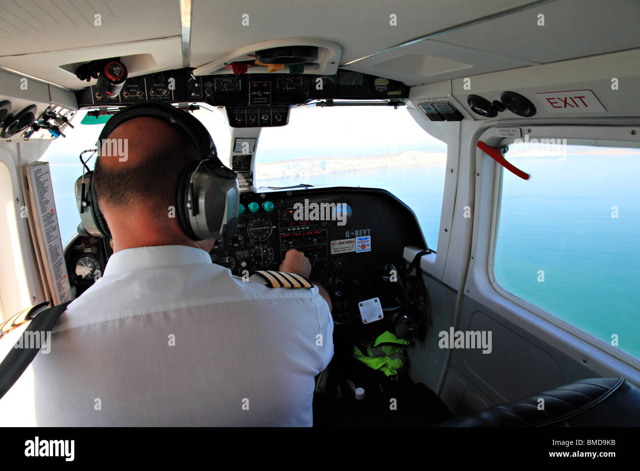Pilot flying Trilander plane to Alderney, Channel Island, United ...