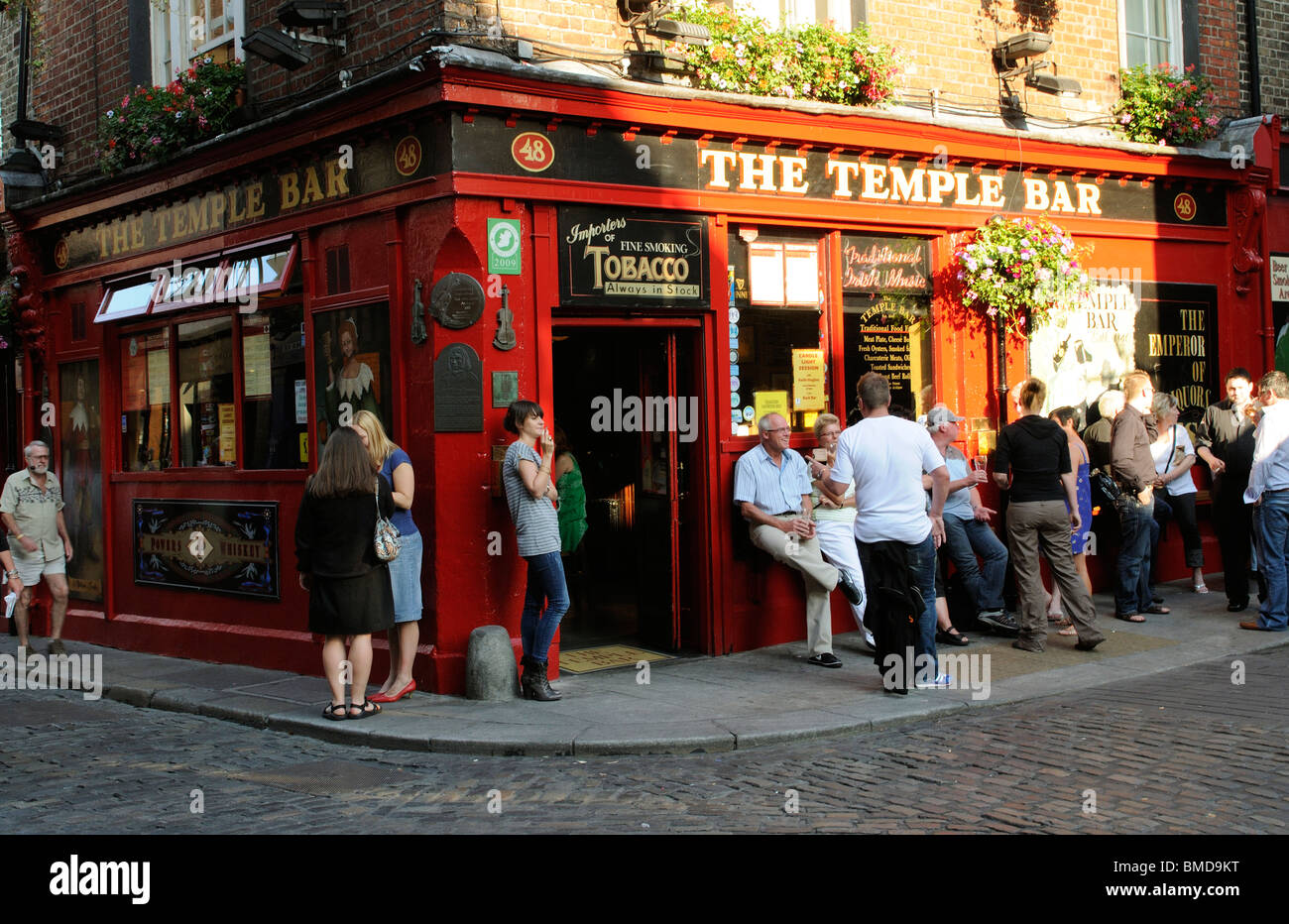 Customers outside the Temple Bar pub in the Temple Bar historic ...