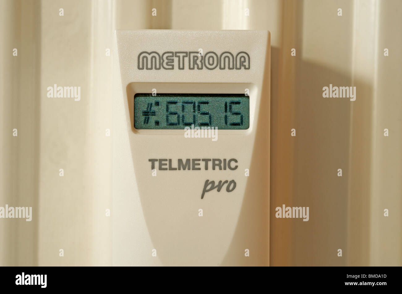 Household meter fitted to a radiator Stock Photo - Alamy
