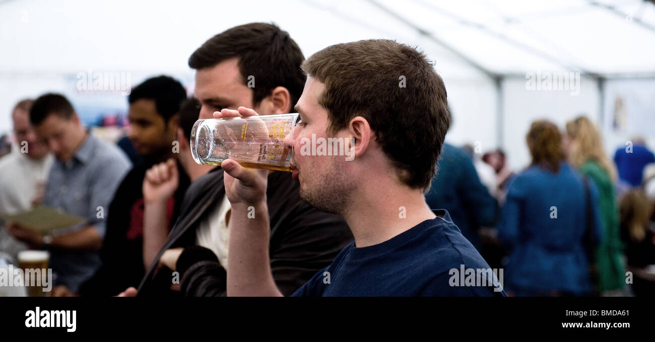 A customer drinking a pint of real ale at the Hoop Beer Festival in ...