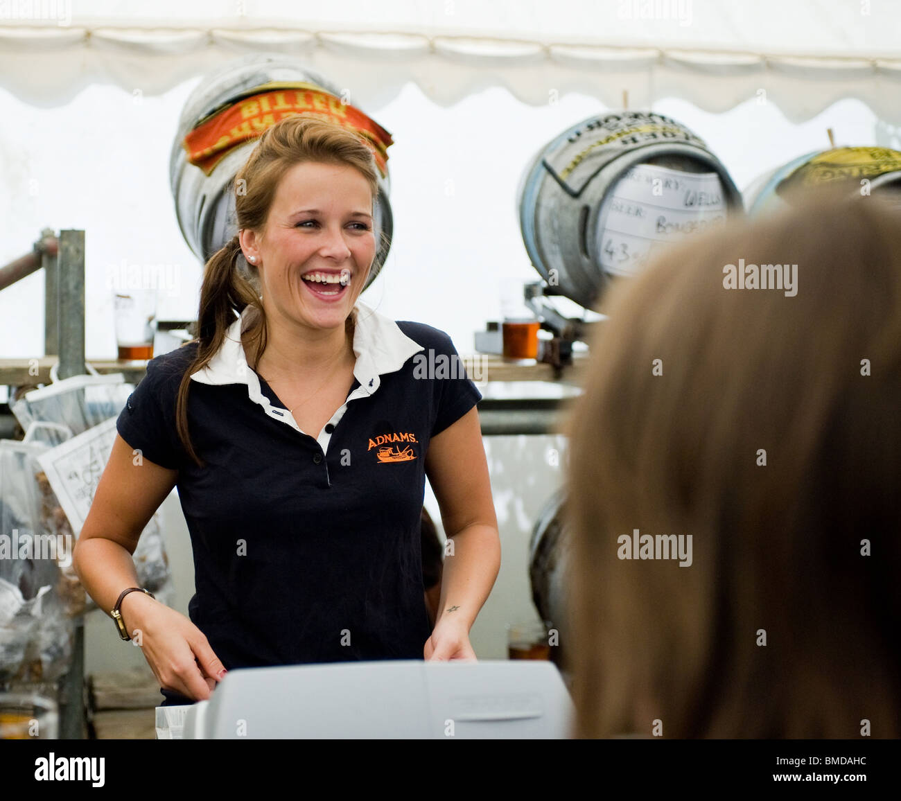 An attractive female bar worker at the Hoop Pub Beer Festival in Stock ...