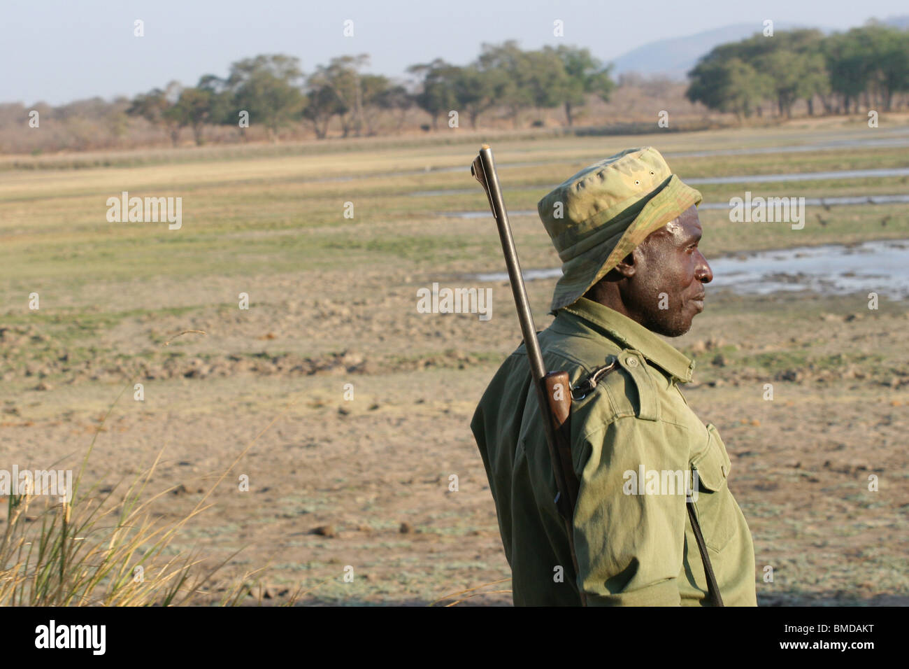 An armed safari guide in Malawi Stock Photo - Alamy