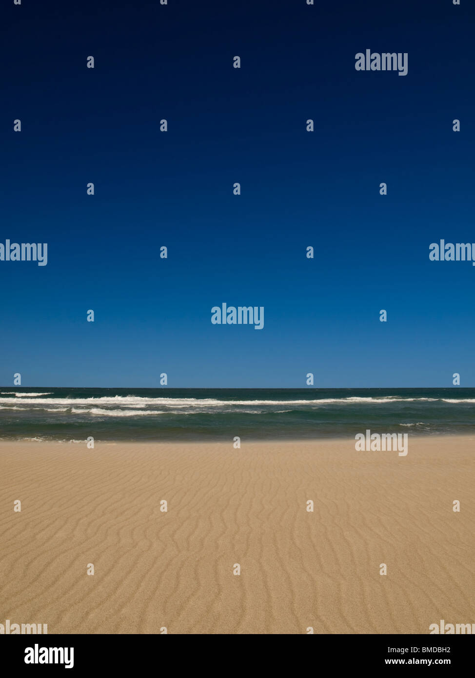 Empty beach on the seafront Stock Photo - Alamy