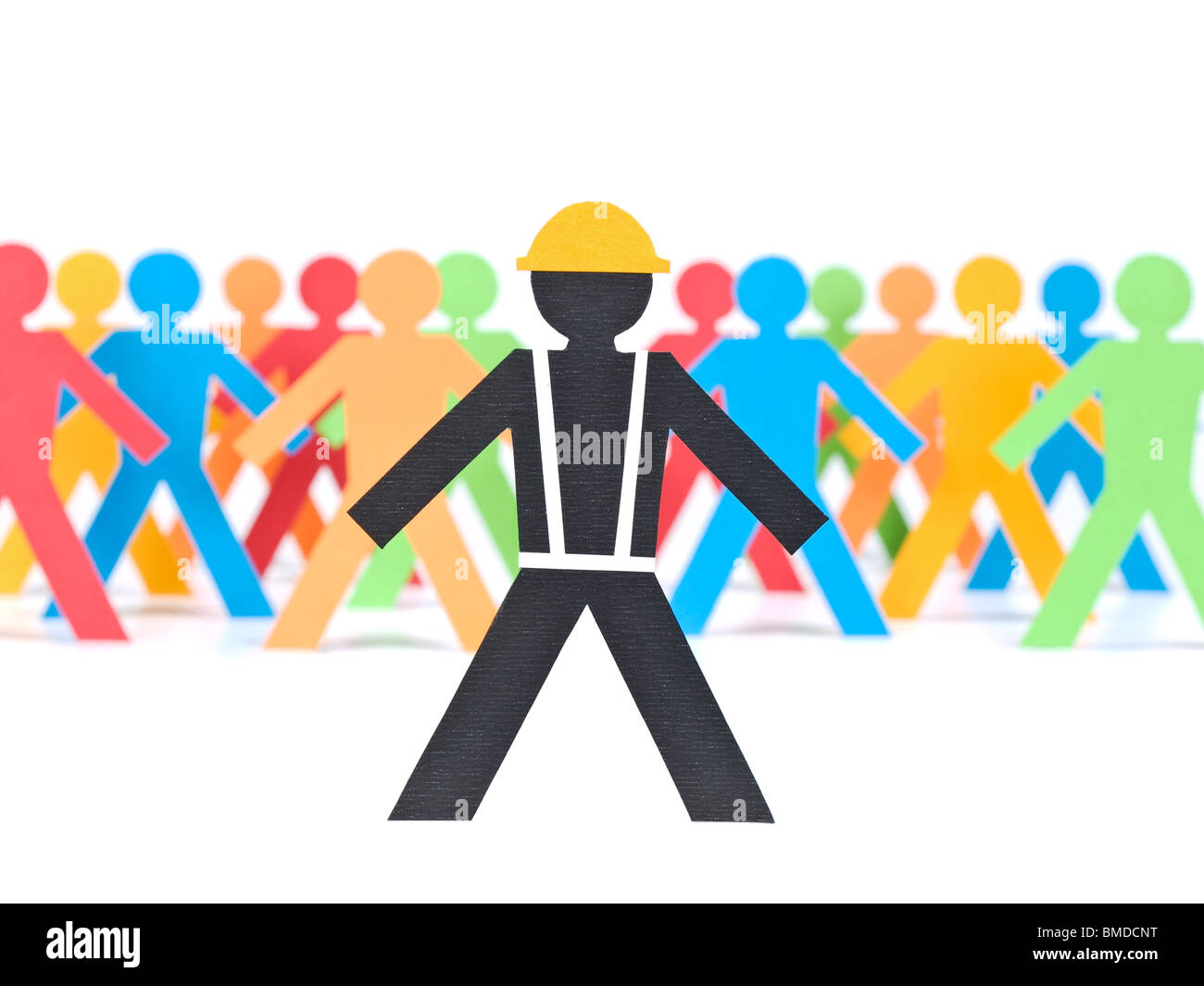 A paper construction worker stands out from the multicolored crowd ...