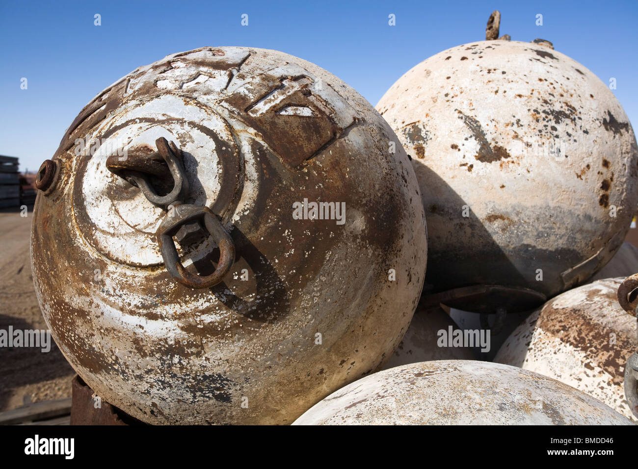 Large iron mooring buoys in scrap yard Stock Photo - Alamy