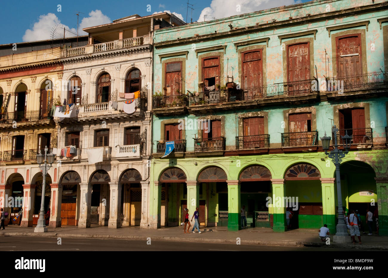 Colorful fading paint buildings with porches in Central Havana Habana ...