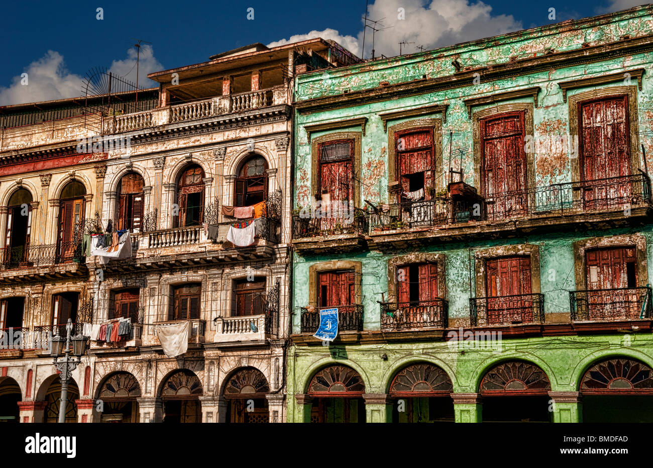 Colorful fading paint buildings with porches in Central Havana Habana ...