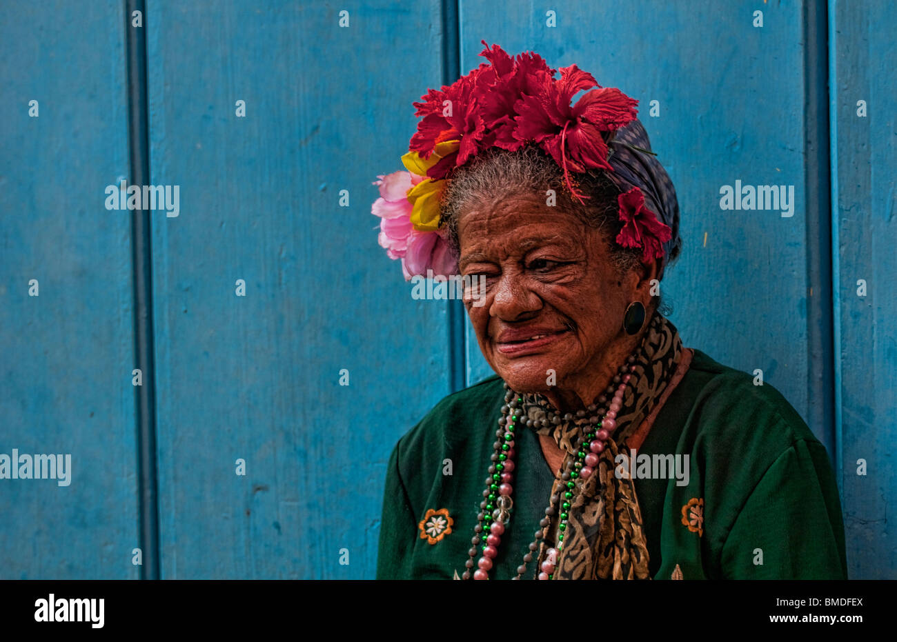 HavanaPortrait of old lady local woman with wrinkles in colorful wall ...