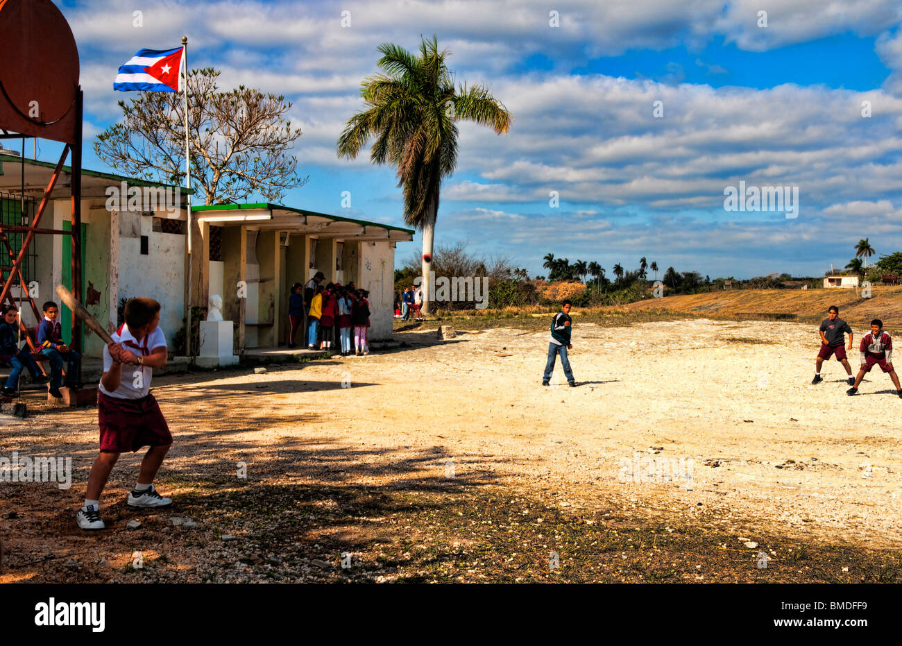 Students playing baseball outside school in Habana Province in ...