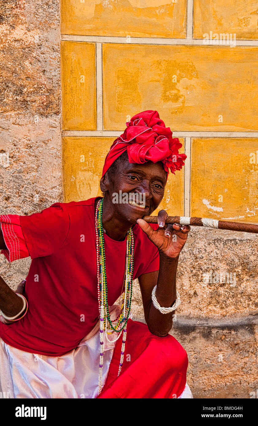 Old Cuban local woman in red with cigar in Old Havana Cuba Habana Stock ...
